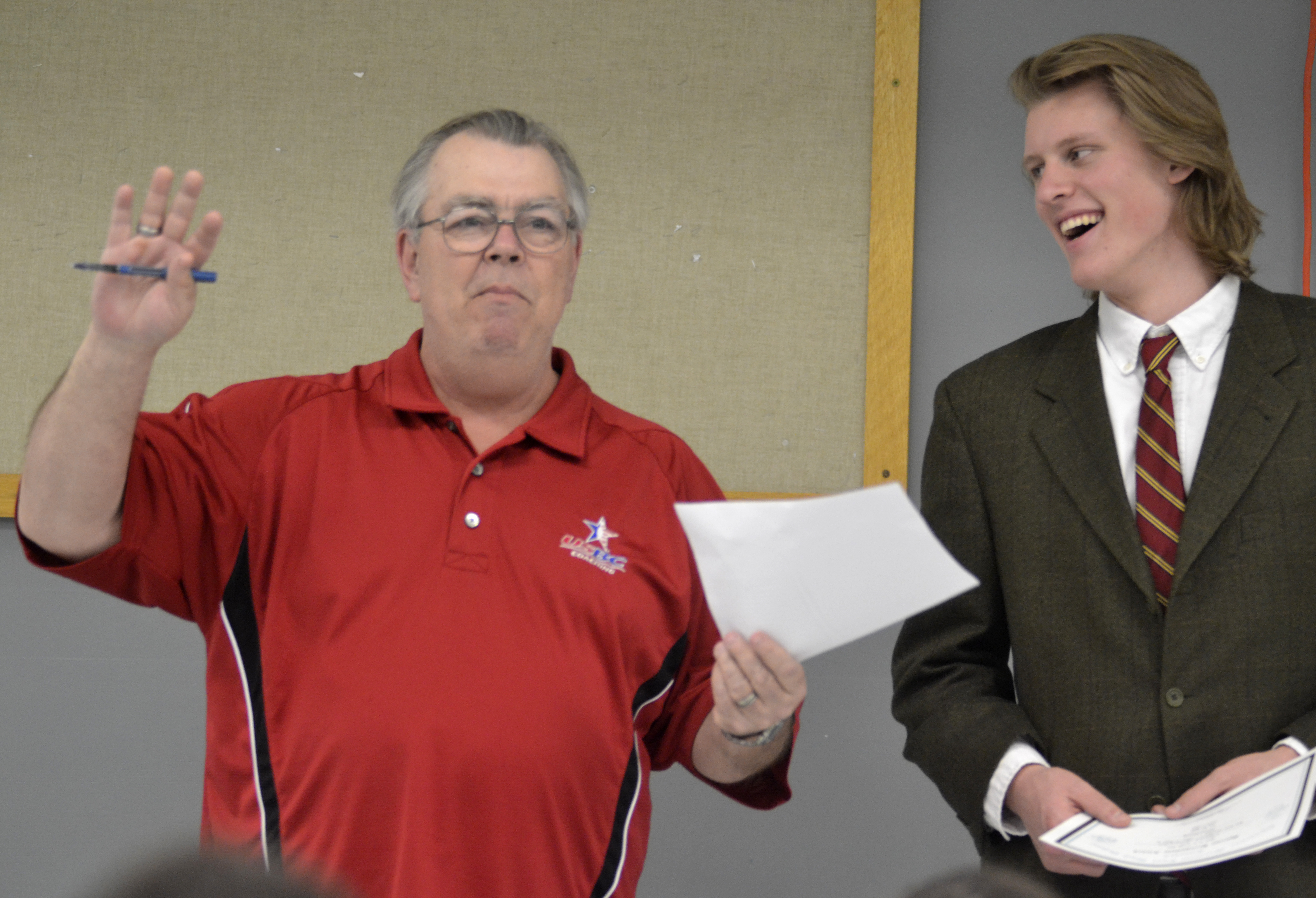 Junior Gabe Snyder laughs at one of coach Larry Kennedy’s jokes. Photo ...