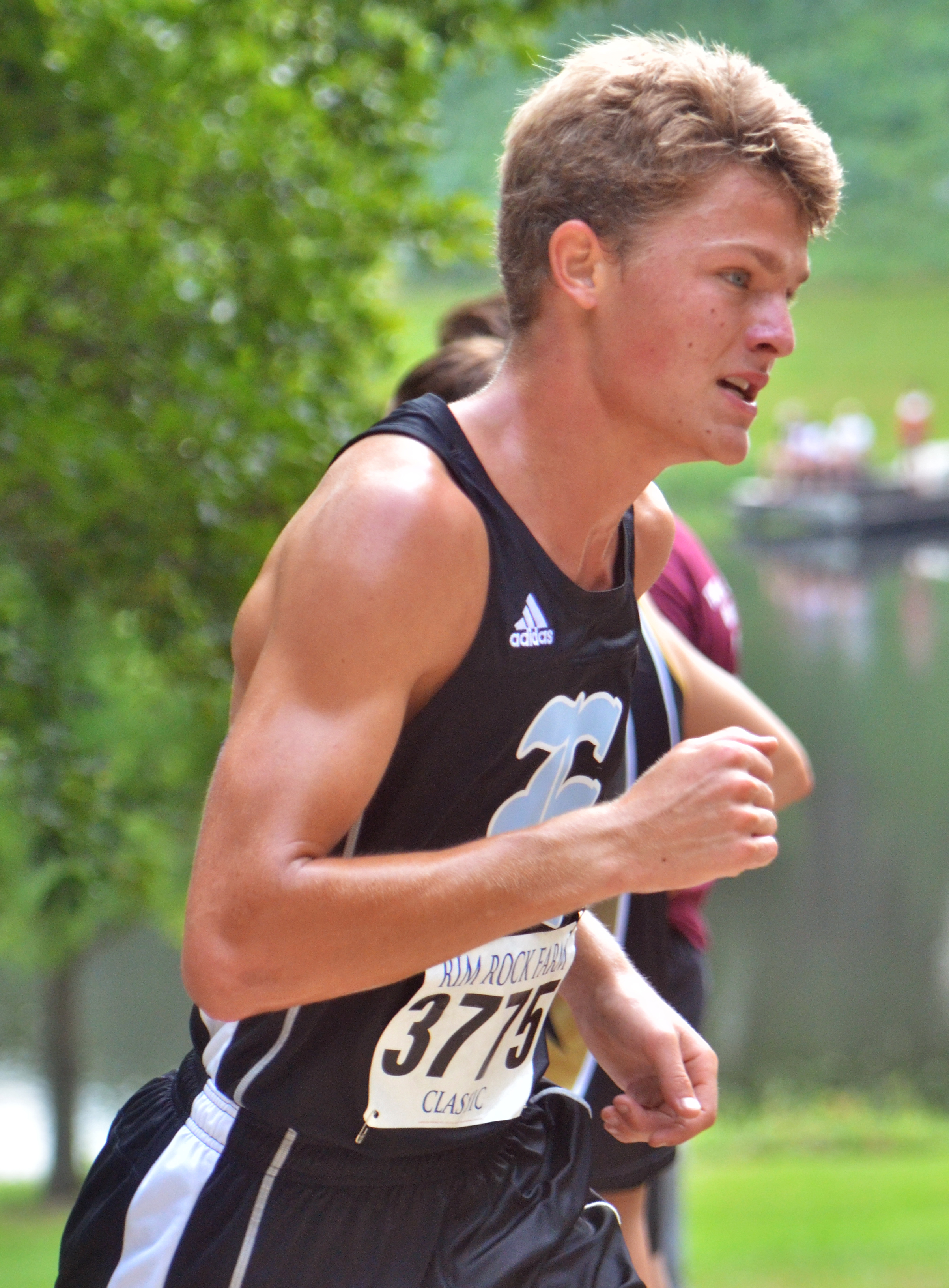 Senior Jack Young runs up the second of the three main hills in the ...