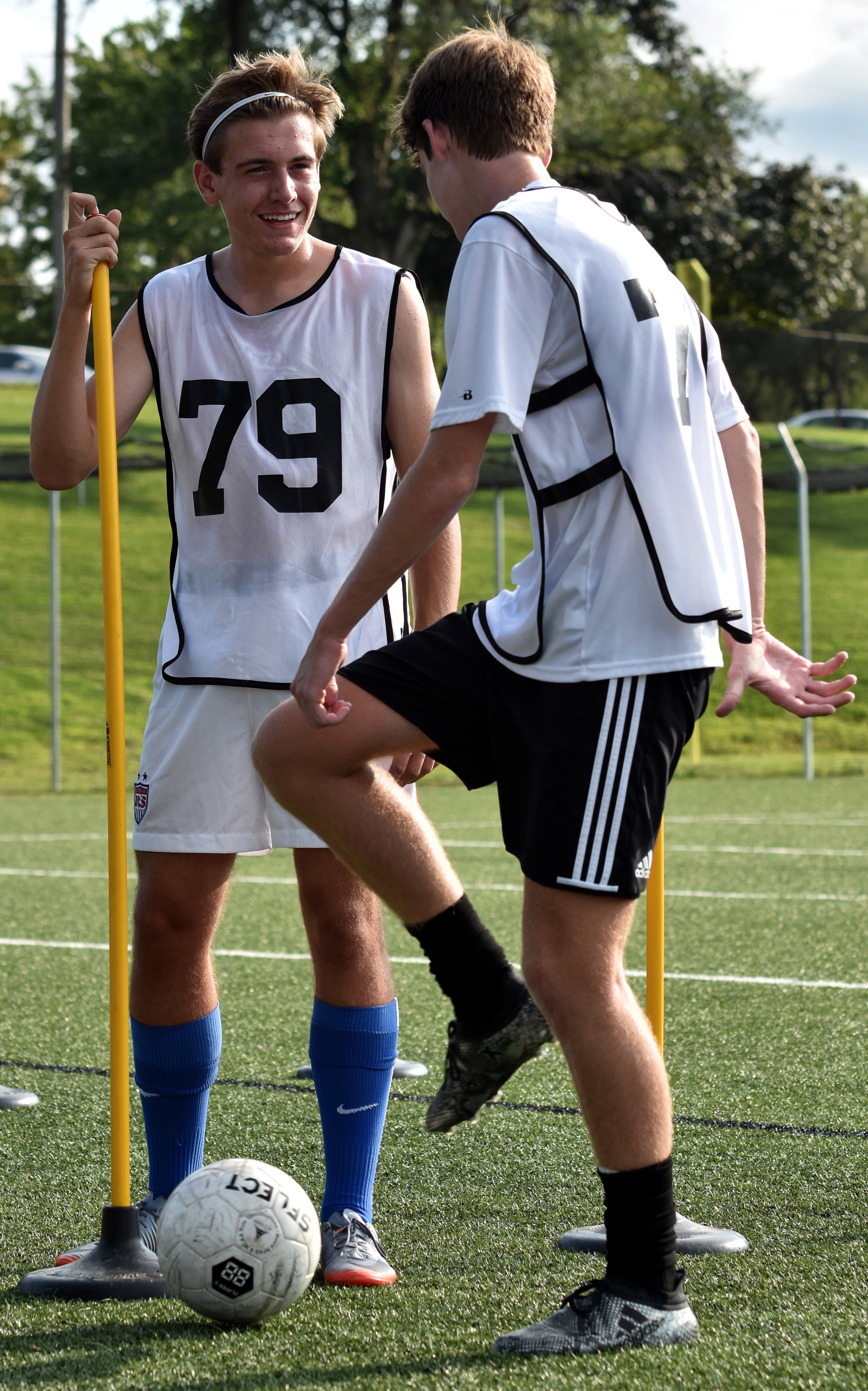 Juniors Harrison Gloe and Conor Otoole talk while they wait for the ...