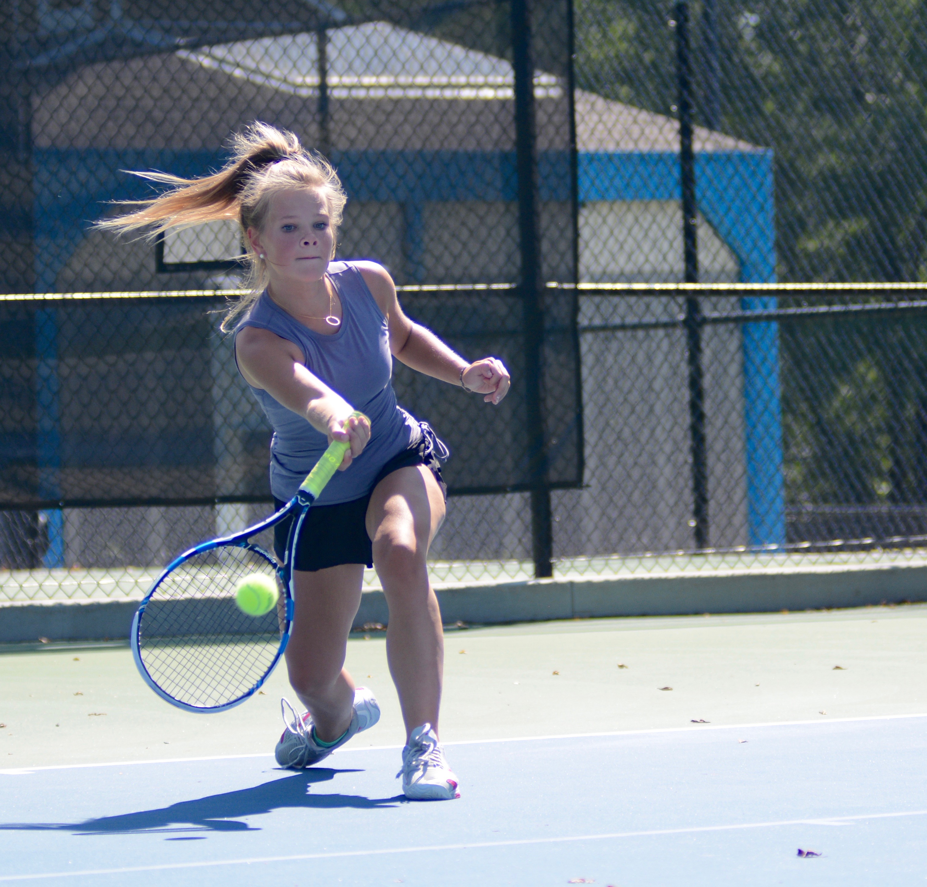 Preparing to hit the ball, Freshman Libby Brouliette eyes the ball ...