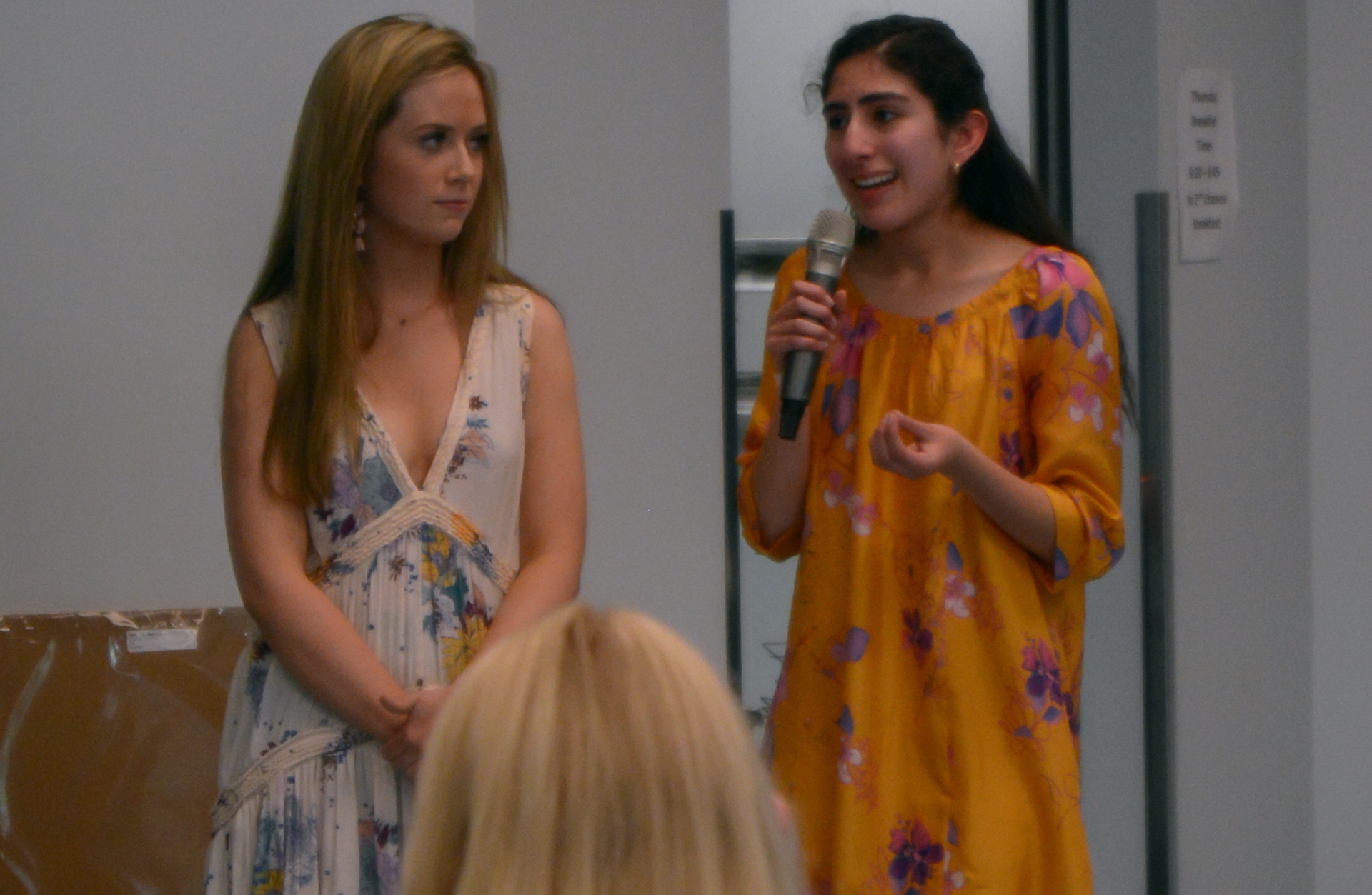 Senior Grace Kenney listens as senior Iman Jaroudi gets emotional while ...