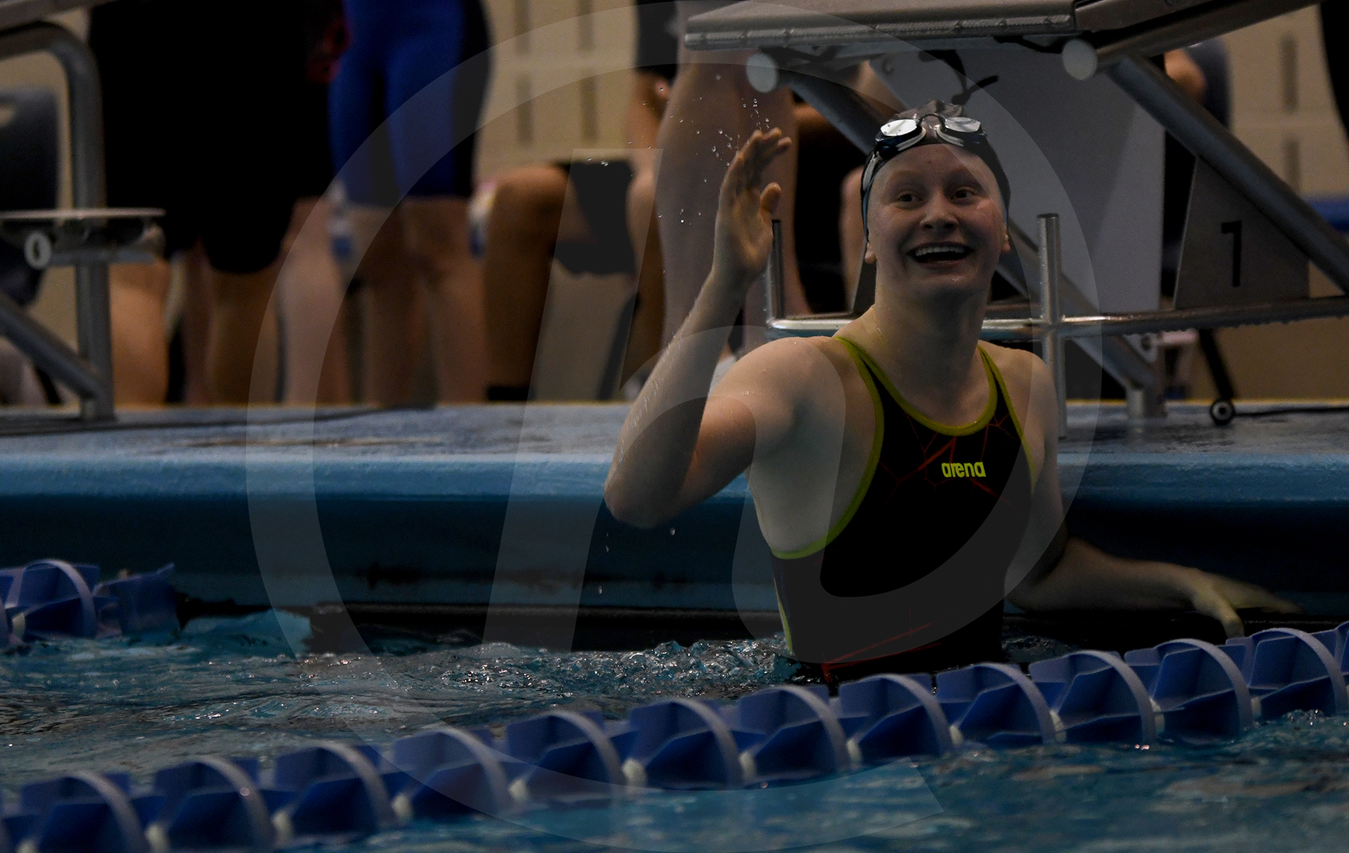 After looking at her time for the 100 yard breaststroke on the board ...